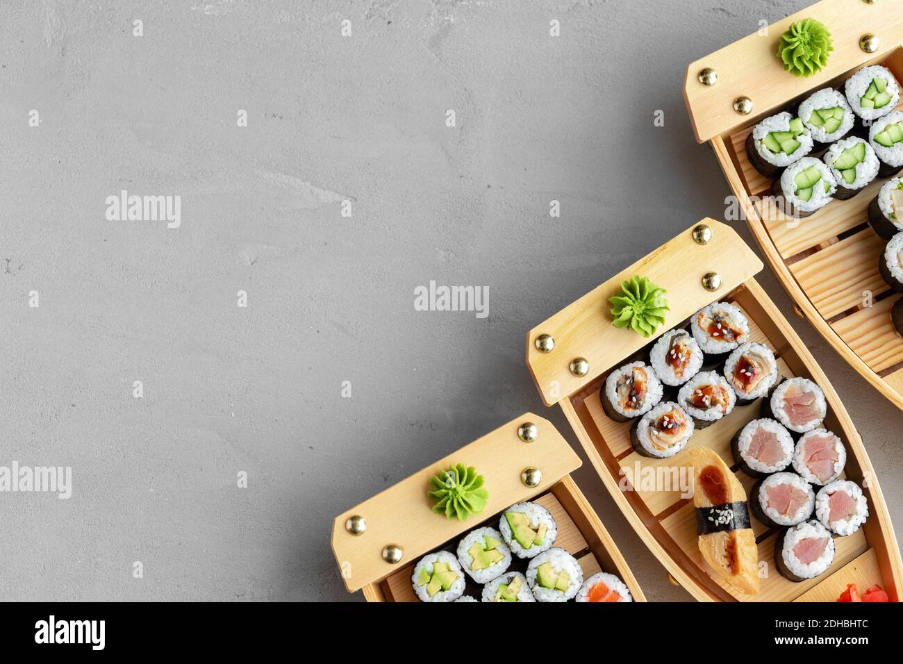 Set of maki sushi on wooden boat tray Stock Photo - Alamy