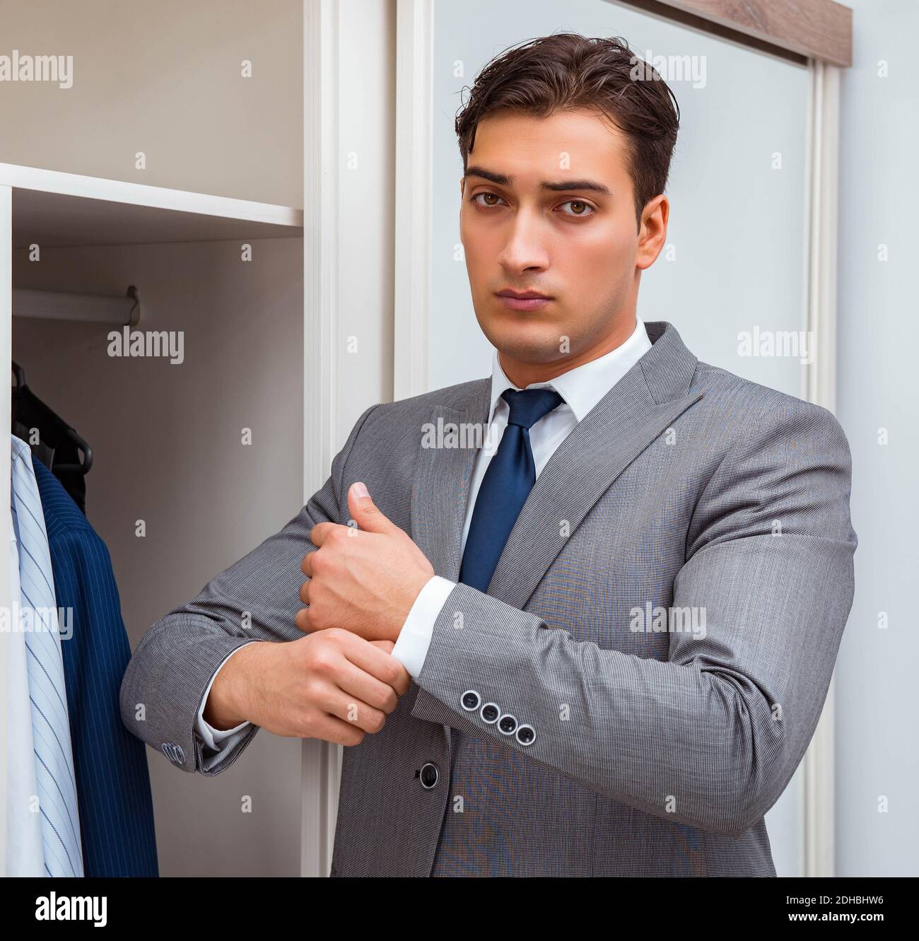 Businessman dressing up for work Stock Photo - Alamy