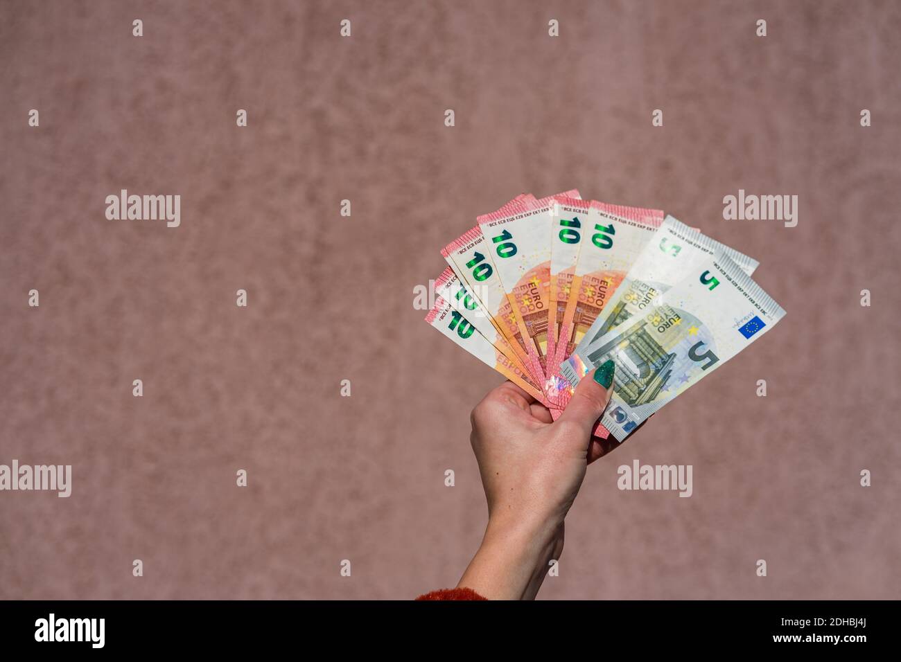 Hand holding showing euro money and giving or receiving money like tips ...