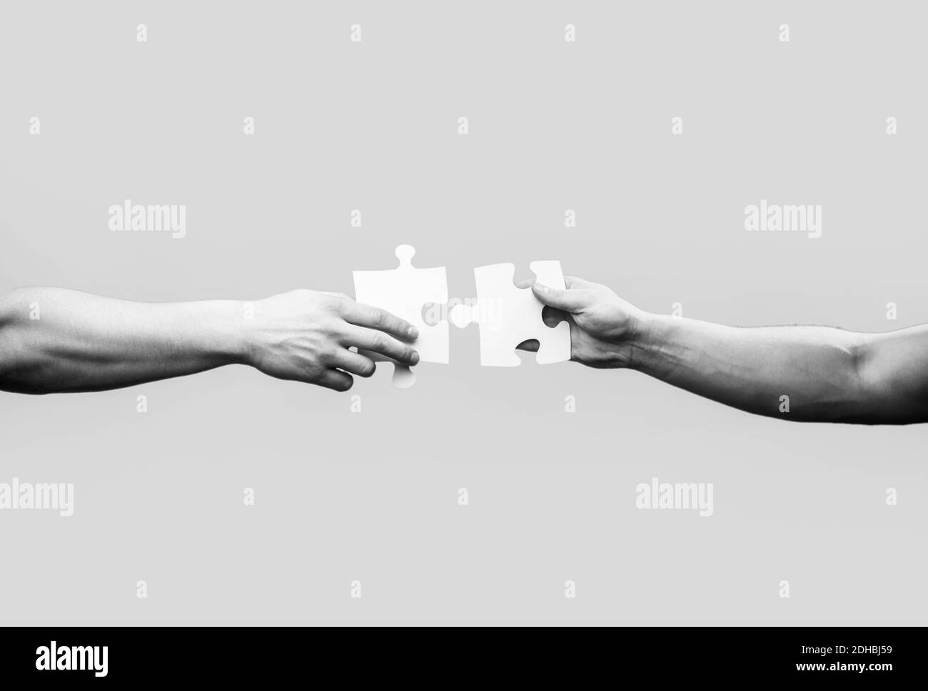 Hand connecting jigsaw puzzle. Business solutions, success and strategy ...