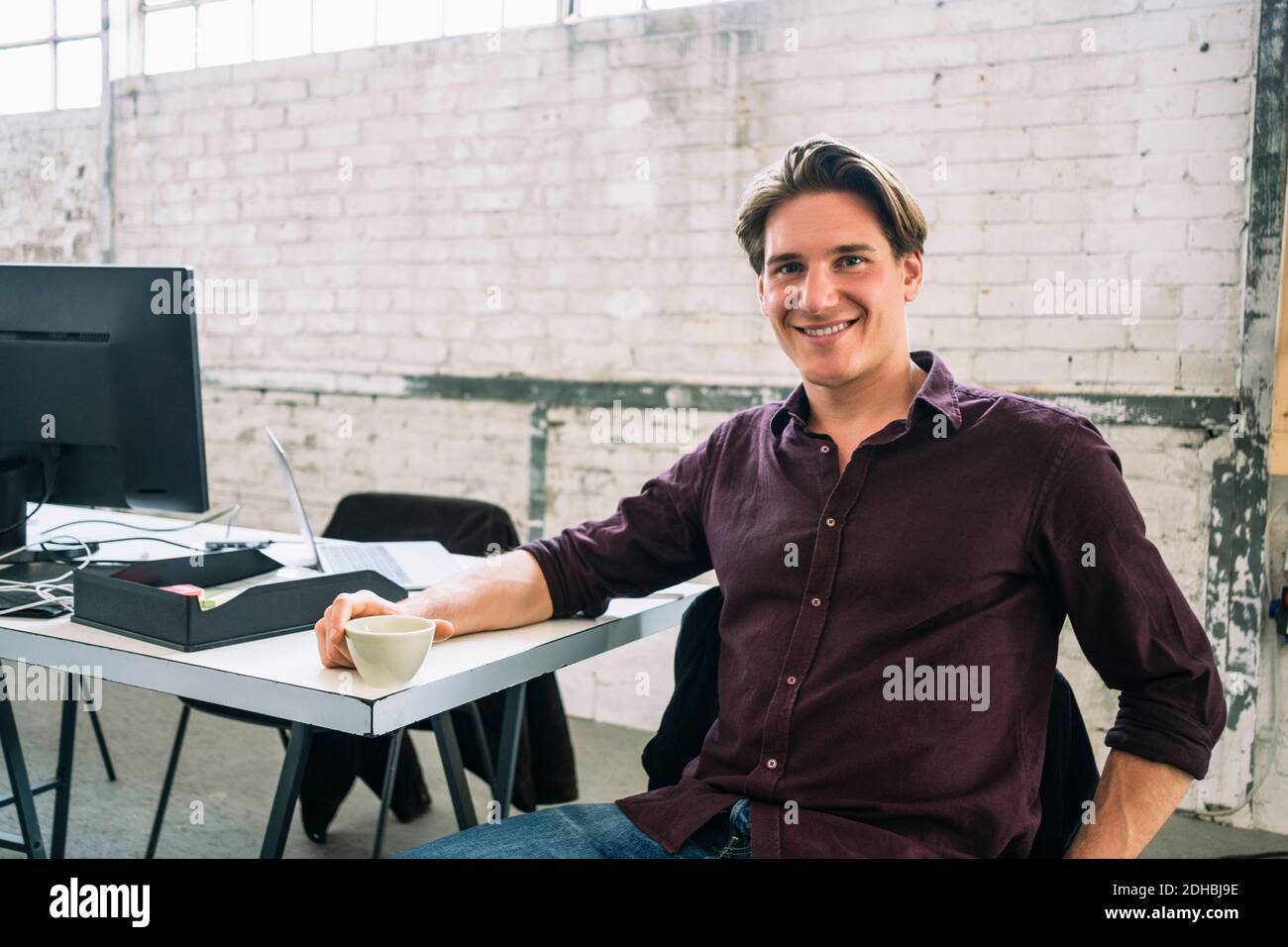 Professional sitting hi-res stock photography and images - Alamy