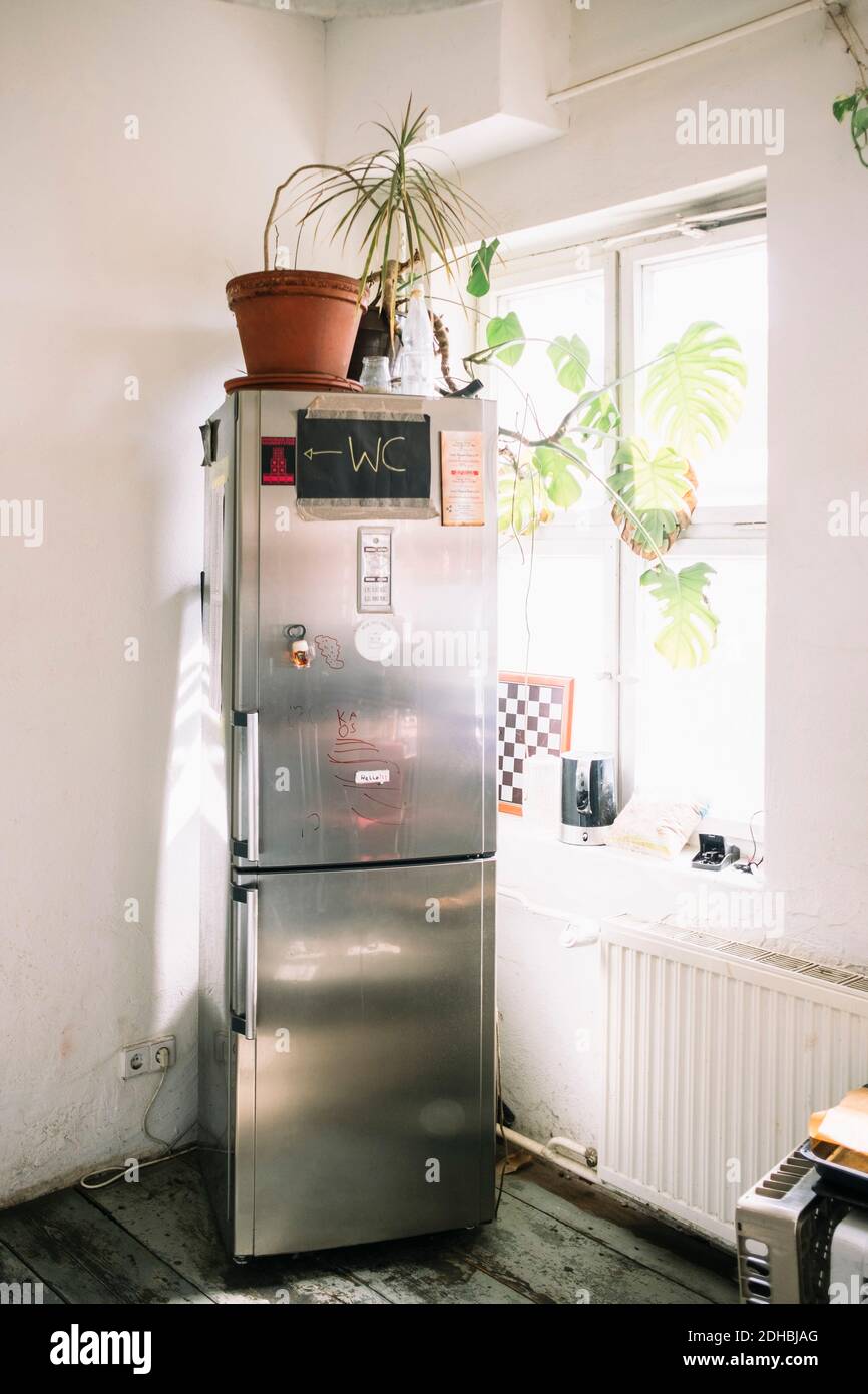 Restroom sign on refrigerator by window at office Stock Photo - Alamy