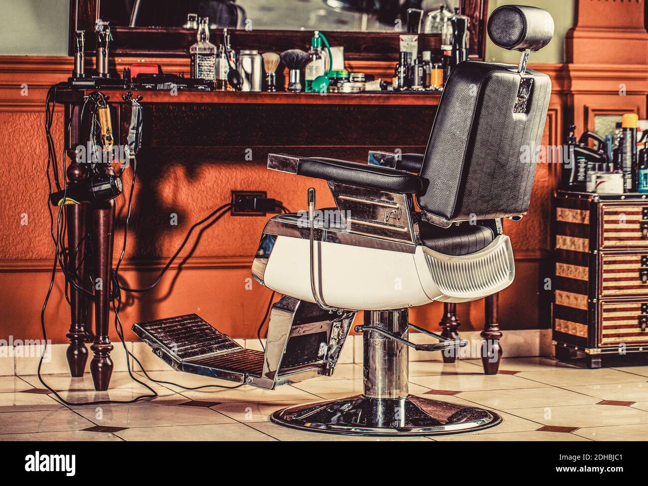 Stylish vintage barber chair. Professional hairstylist in barbershop ...