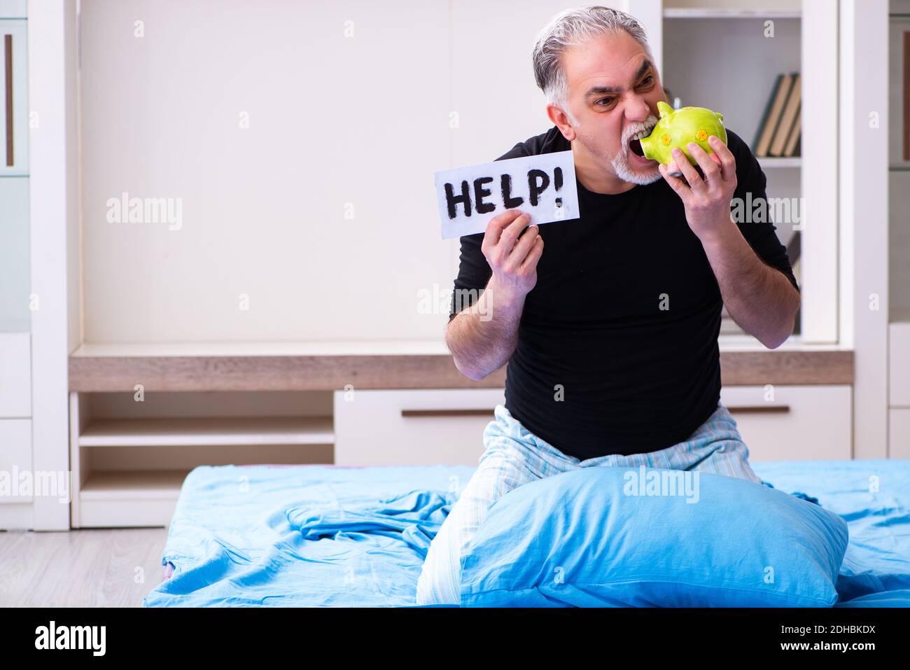 Unhappy old man in retirement concept Stock Photo - Alamy