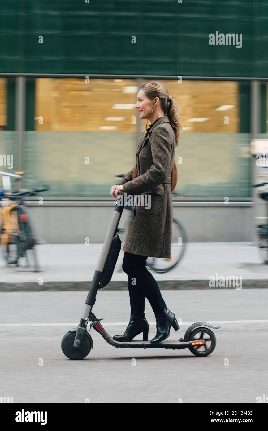Girl on push scooter hi-res stock photography and images - Alamy