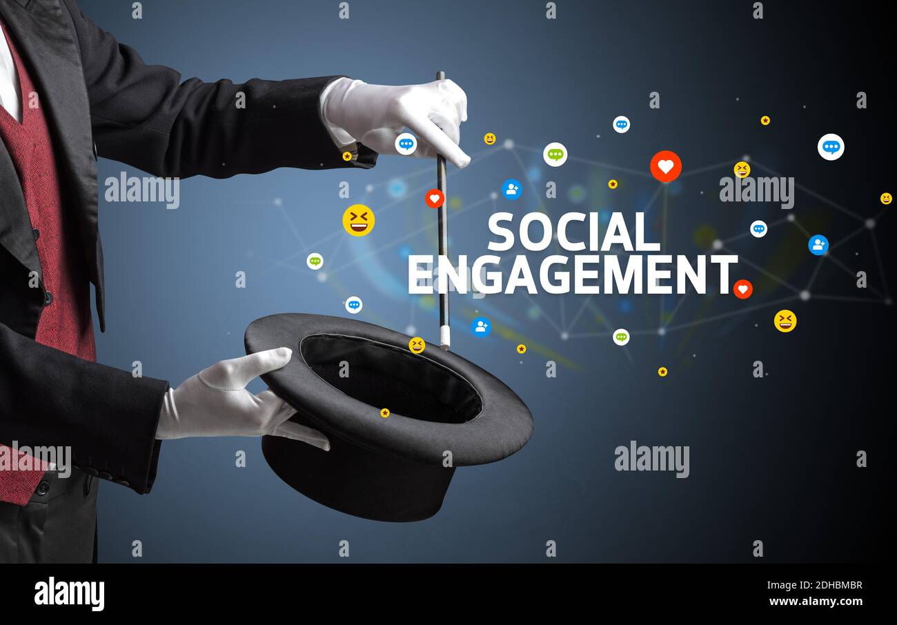 Magician is showing magic trick with SOCIAL ENGAGEMENT inscription ...