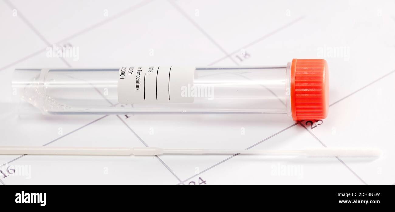Rapid test kit, vial with orange cap and swab, sticker for patient data ...