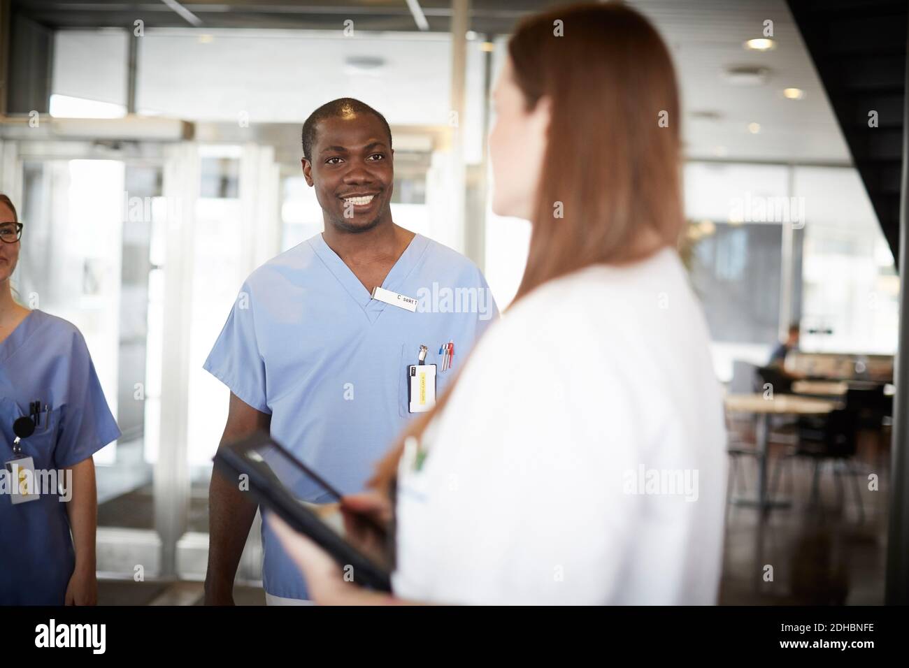 Doctor standing nurses hi-res stock photography and images - Alamy