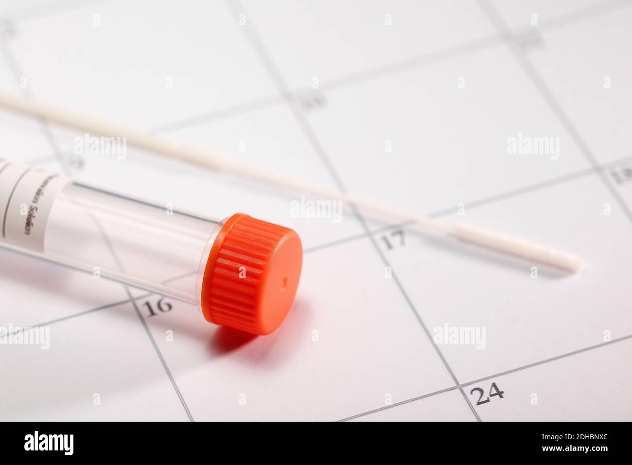 Rapid test kit, vial with orange cap and swab, sticker for patient data ...