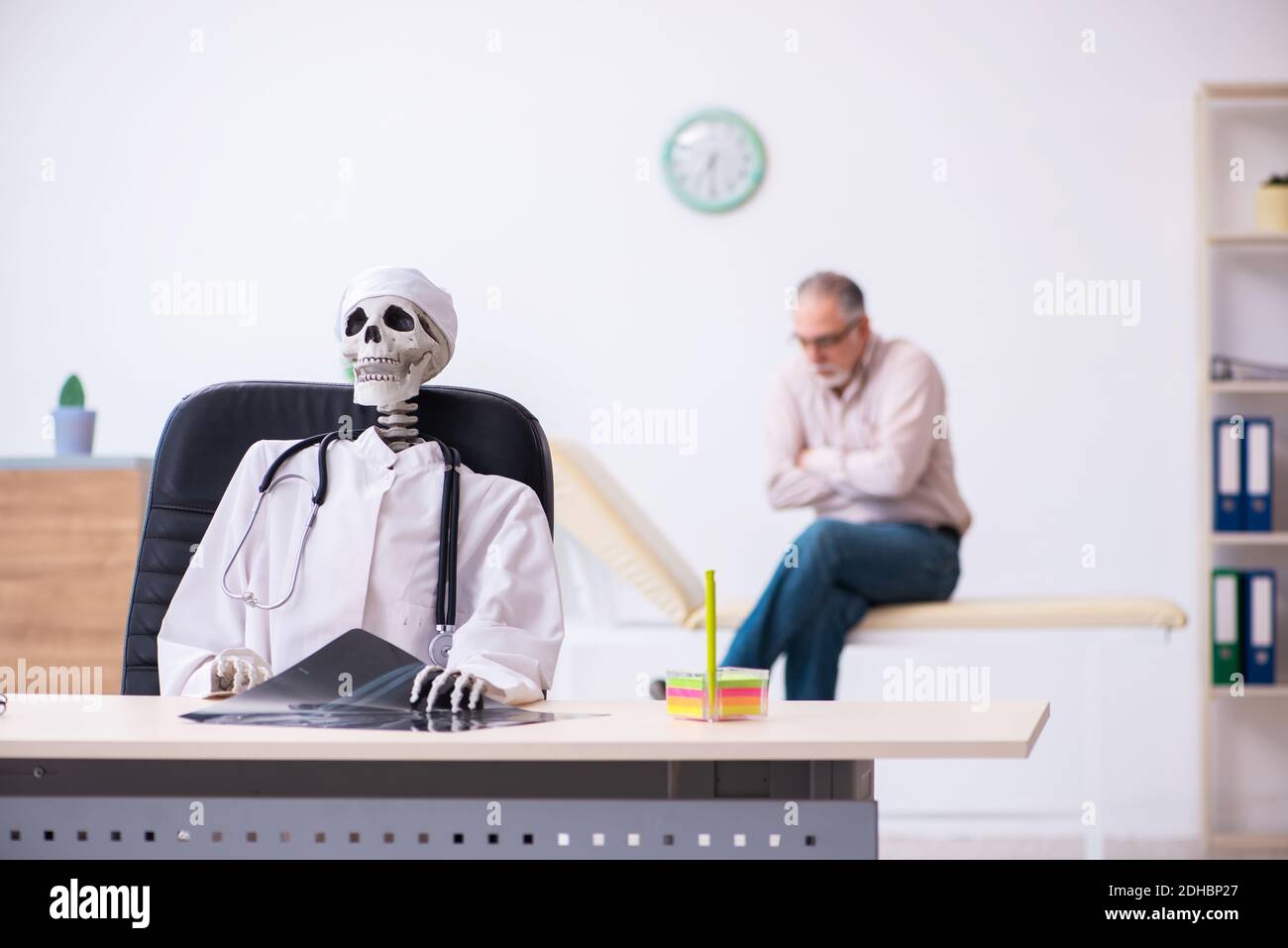 Old man visiting dead doctor radiologist Stock Photo - Alamy