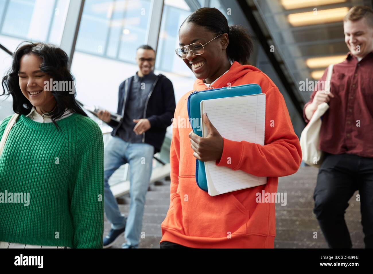 Group young people walking low angle hi-res stock photography and ...