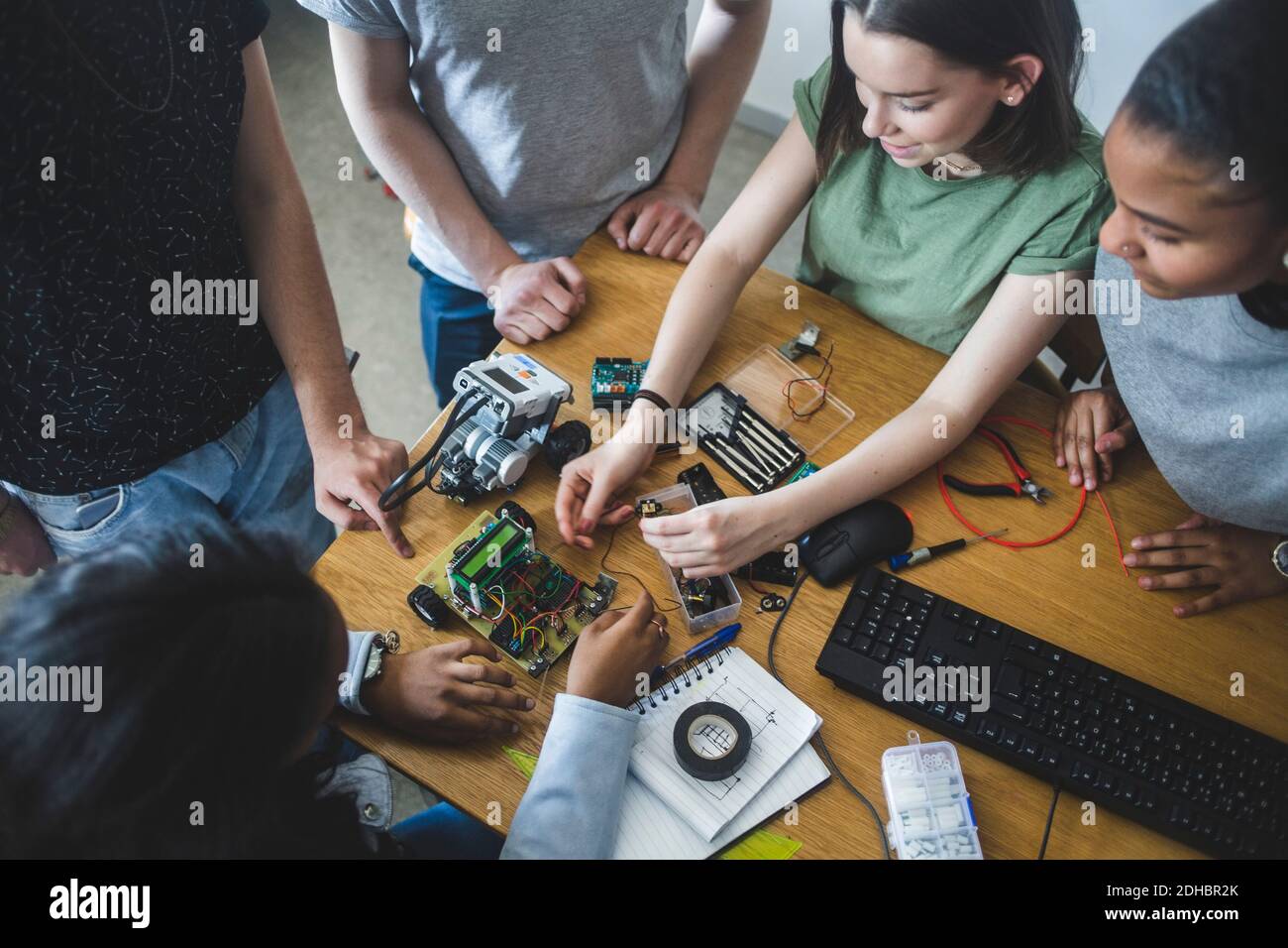 High angle view of multi-ethnic high school students preparing science ...