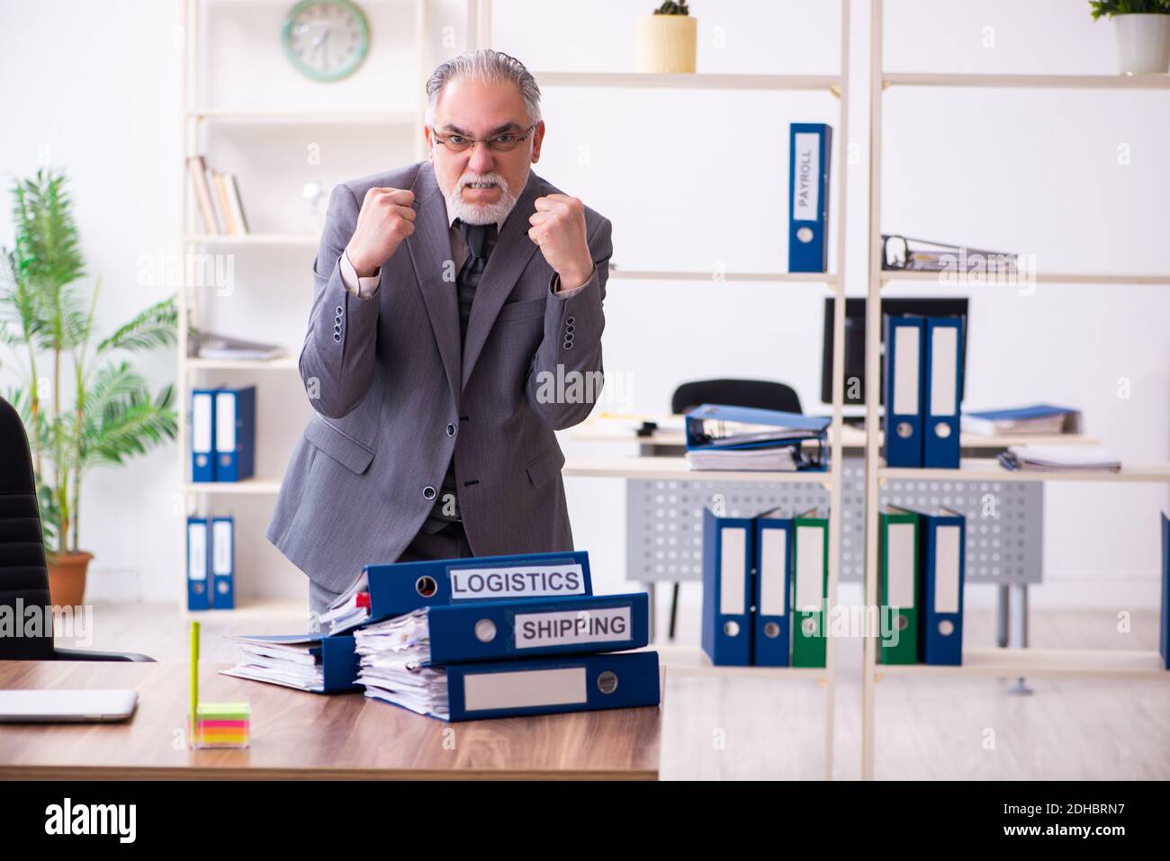 Businessman angry and furious at the workplace Stock Photo - Alamy