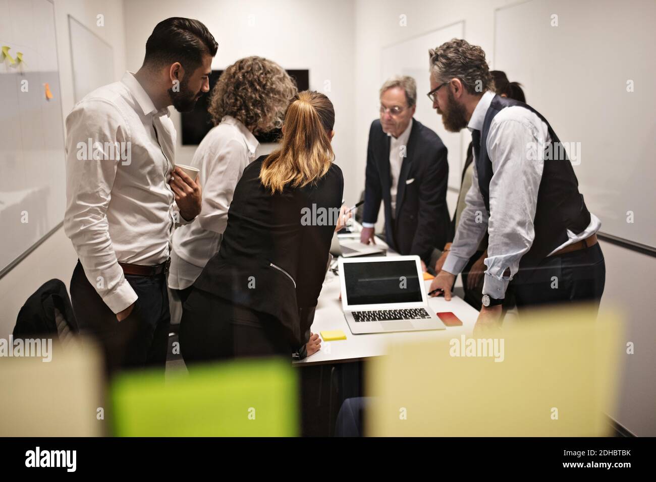 Business team planning strategy at conference table in office meeting ...