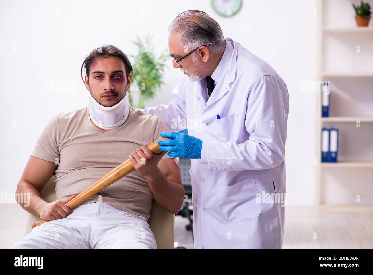 Young face injured man visiting experienced male doctor traumato Stock ...