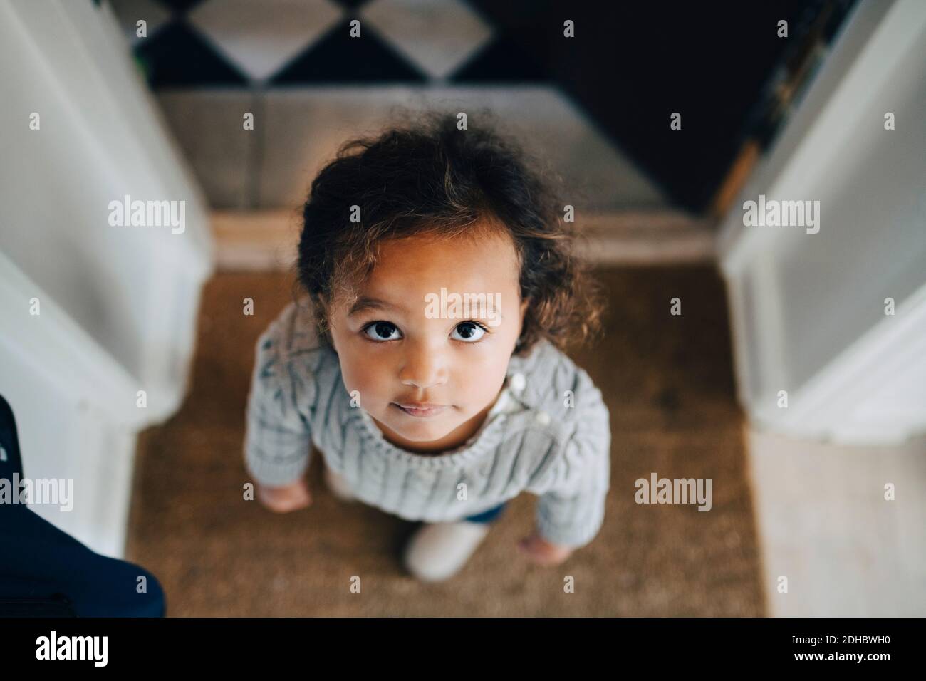 High angle portrait of girl standing at home Stock Photo - Alamy