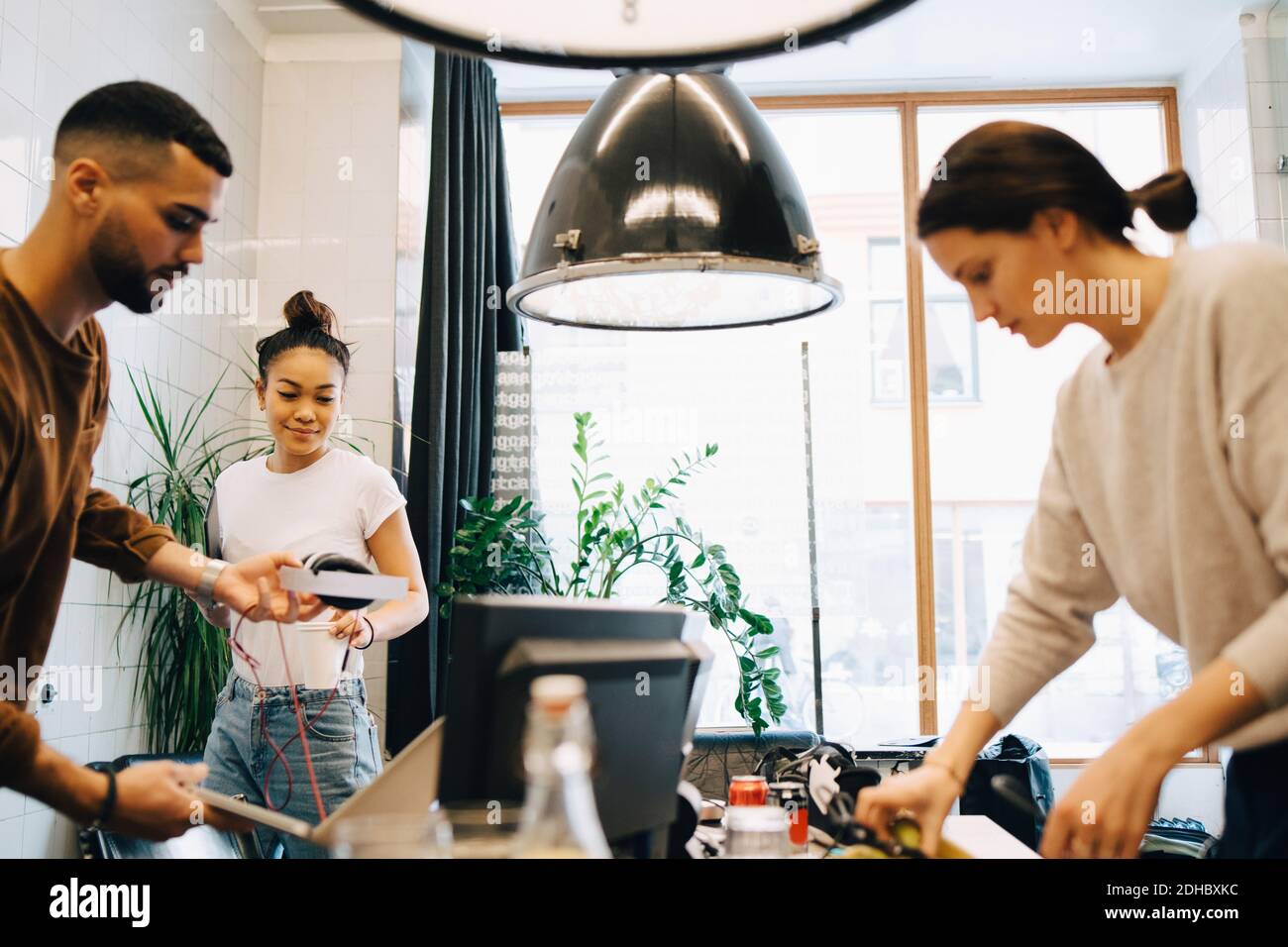 Young multi-ethnic programmers working at small creative office Stock ...
