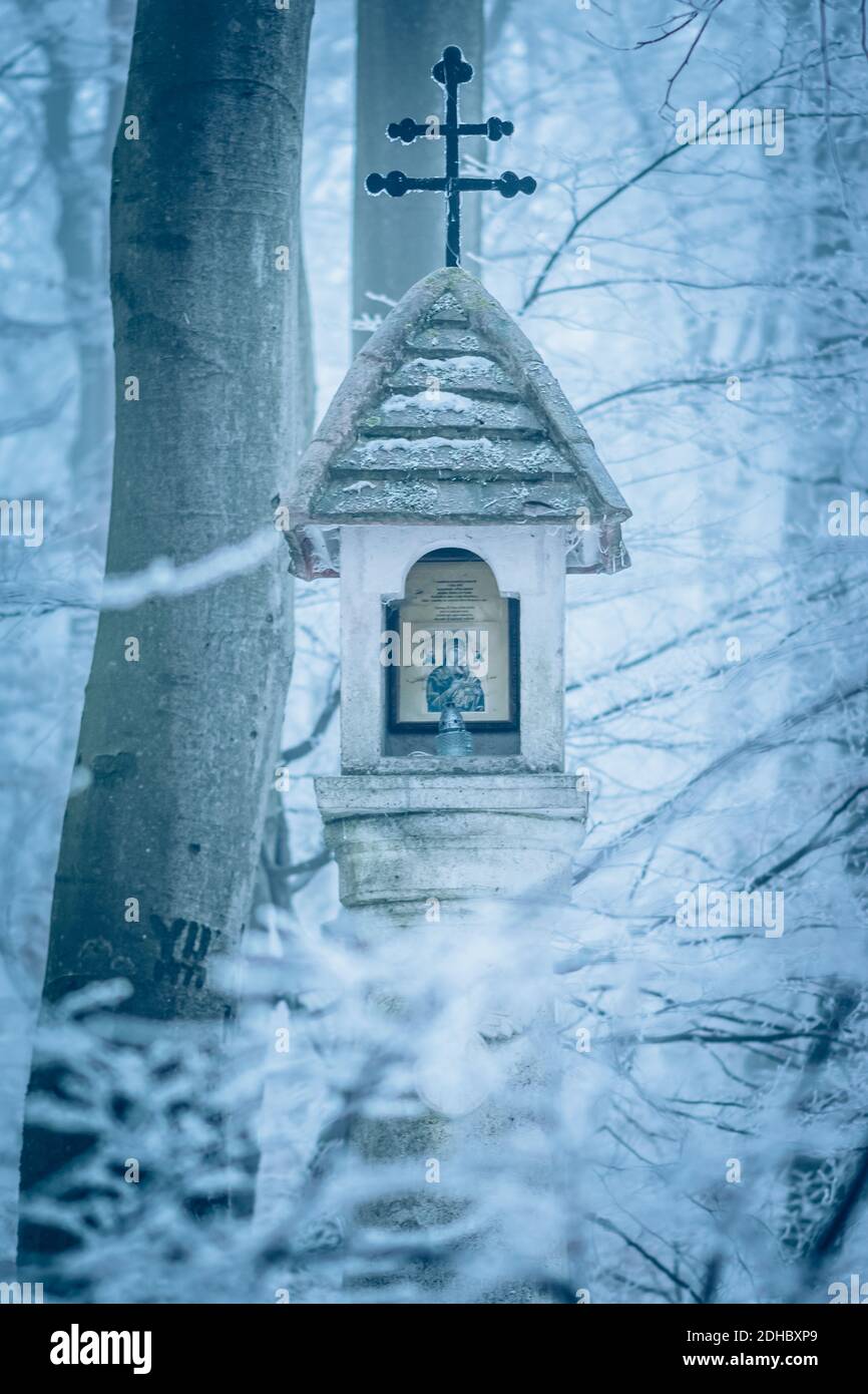 scenic and romantic religious symbol in forest Stock Photo - Alamy