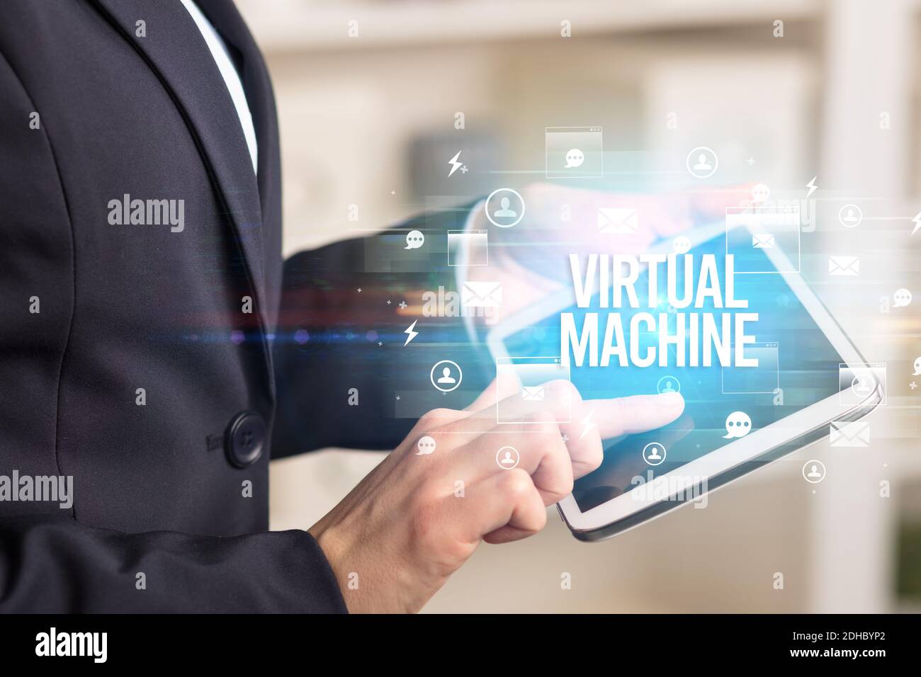 Close-up of a tablet searching VIRTUAL MACHINE inscription, modern ...