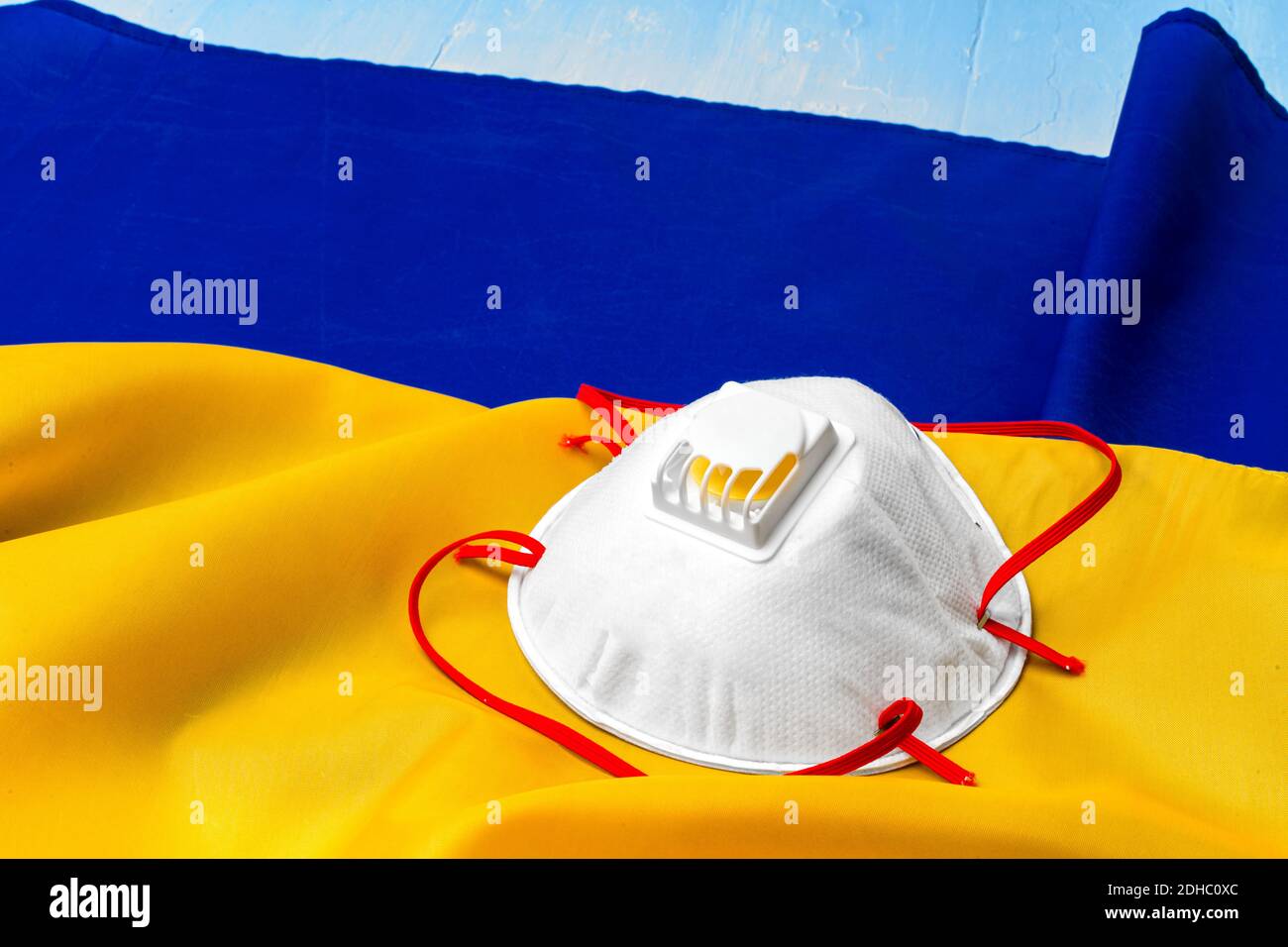 Medical face mask on the flag of Ukraine Stock Photo - Alamy