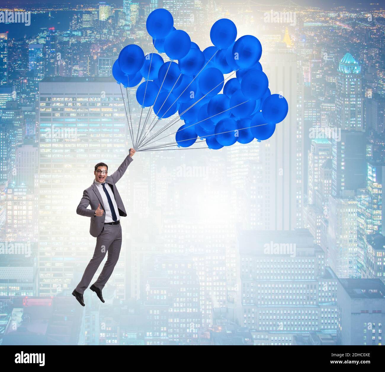 Businessman flying on balloon in challenge concept Stock Photo - Alamy