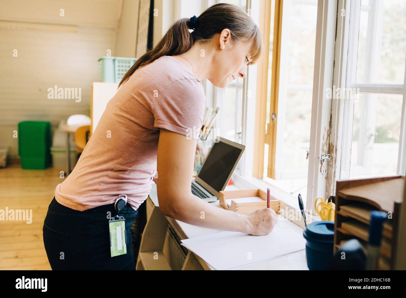 Primary school back view teacher hi-res stock photography and images ...