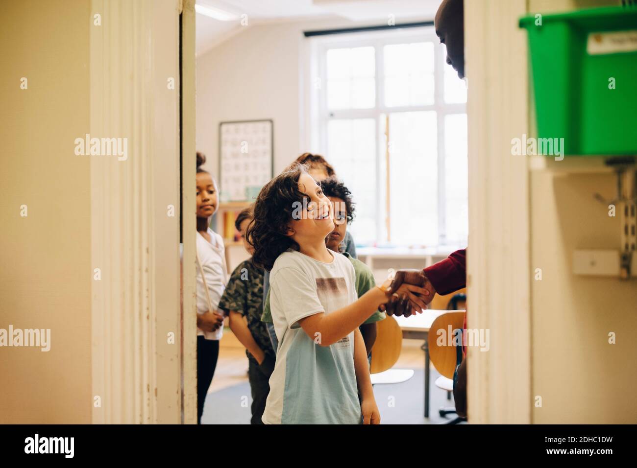 Shaking hand school hi-res stock photography and images - Alamy