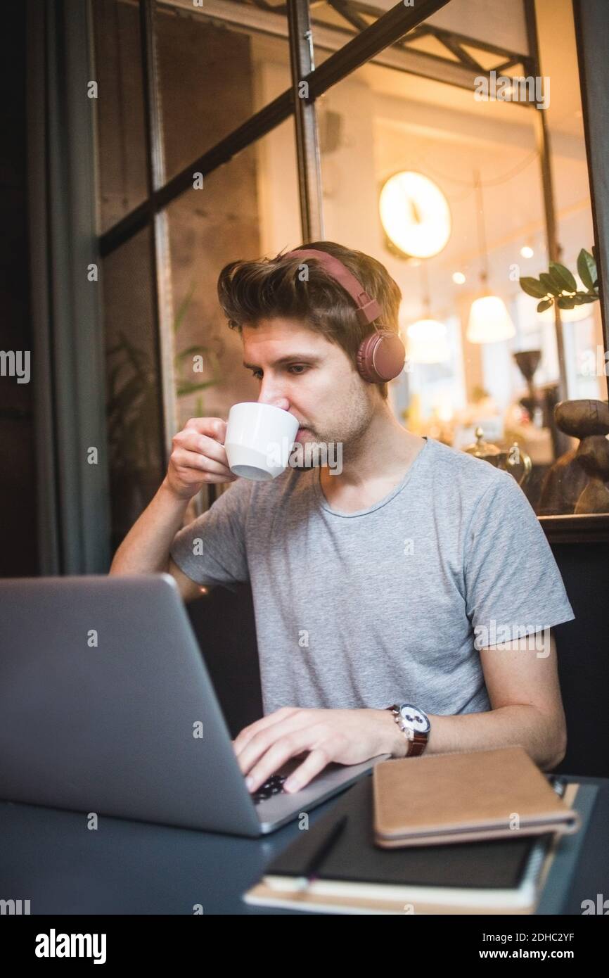 Businessman drinking coffee using hi-res stock photography and images ...