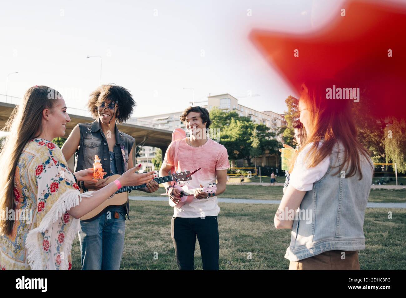 Young women talking during music hi-res stock photography and images ...
