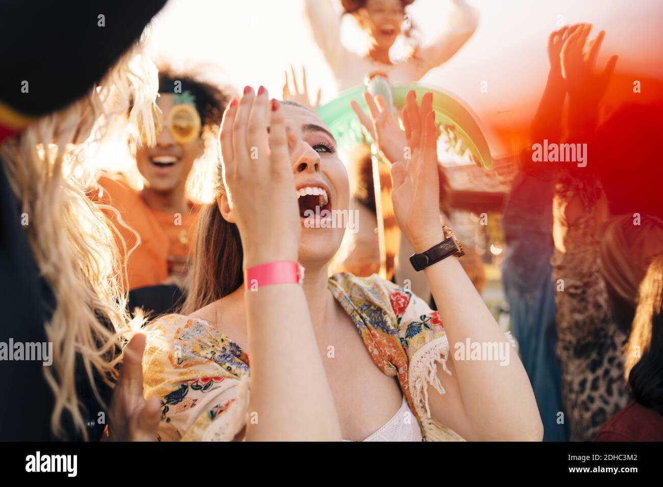 Female fan screaming in crowd at music concert Stock Photo - Alamy
