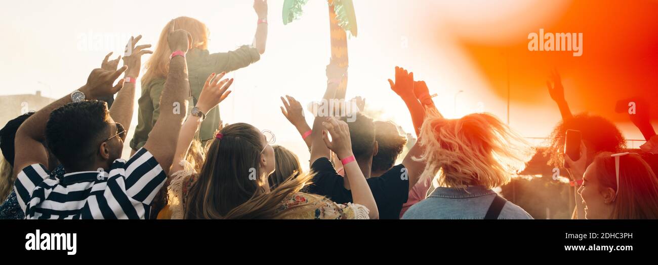 Panoramic view of male and female fans enjoying at music concert Stock ...