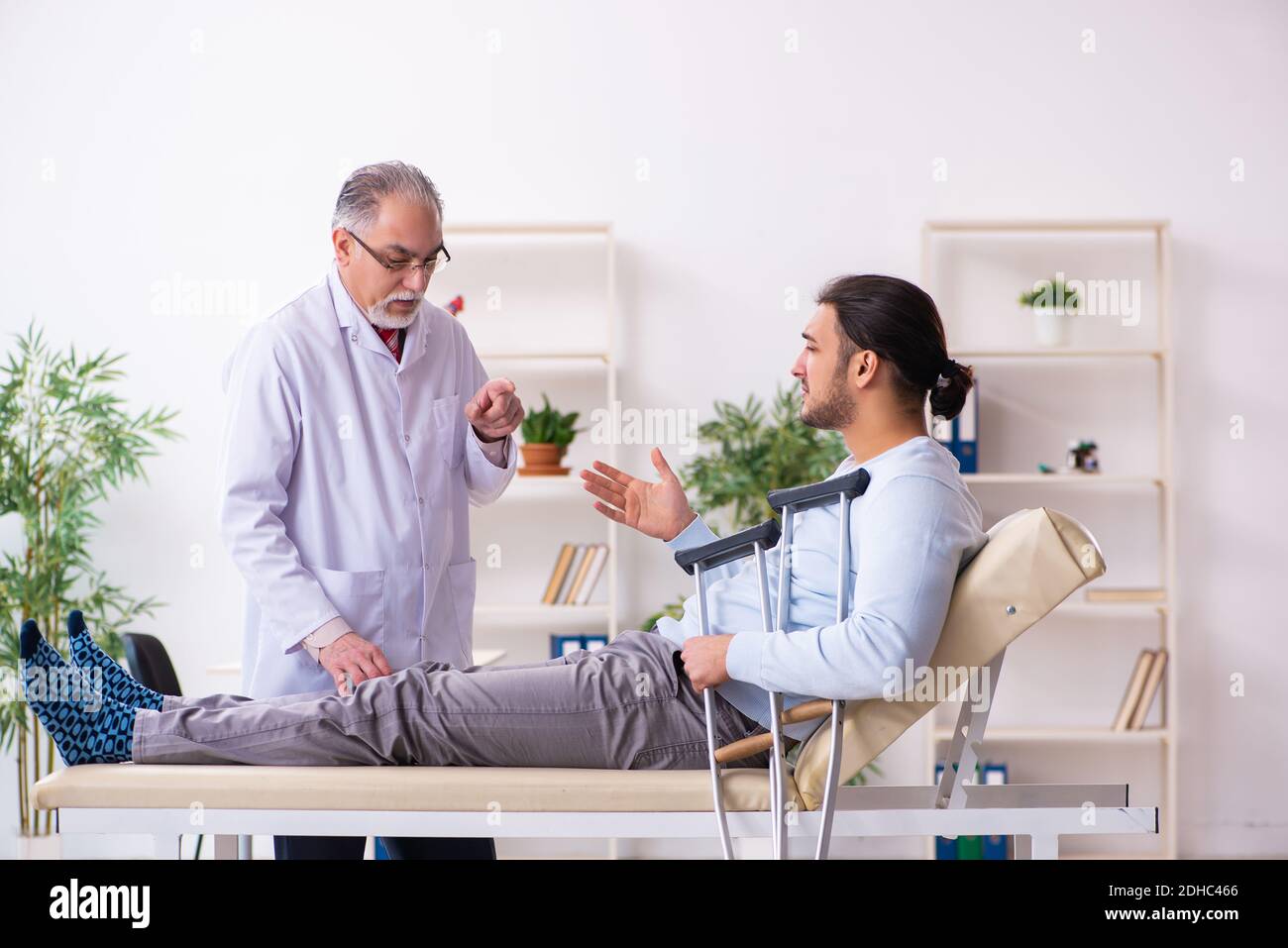 Young man osteopath checking hi-res stock photography and images - Alamy