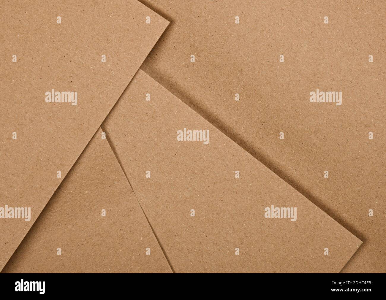 Close up abstract background of several natural brown paper sheets for ...