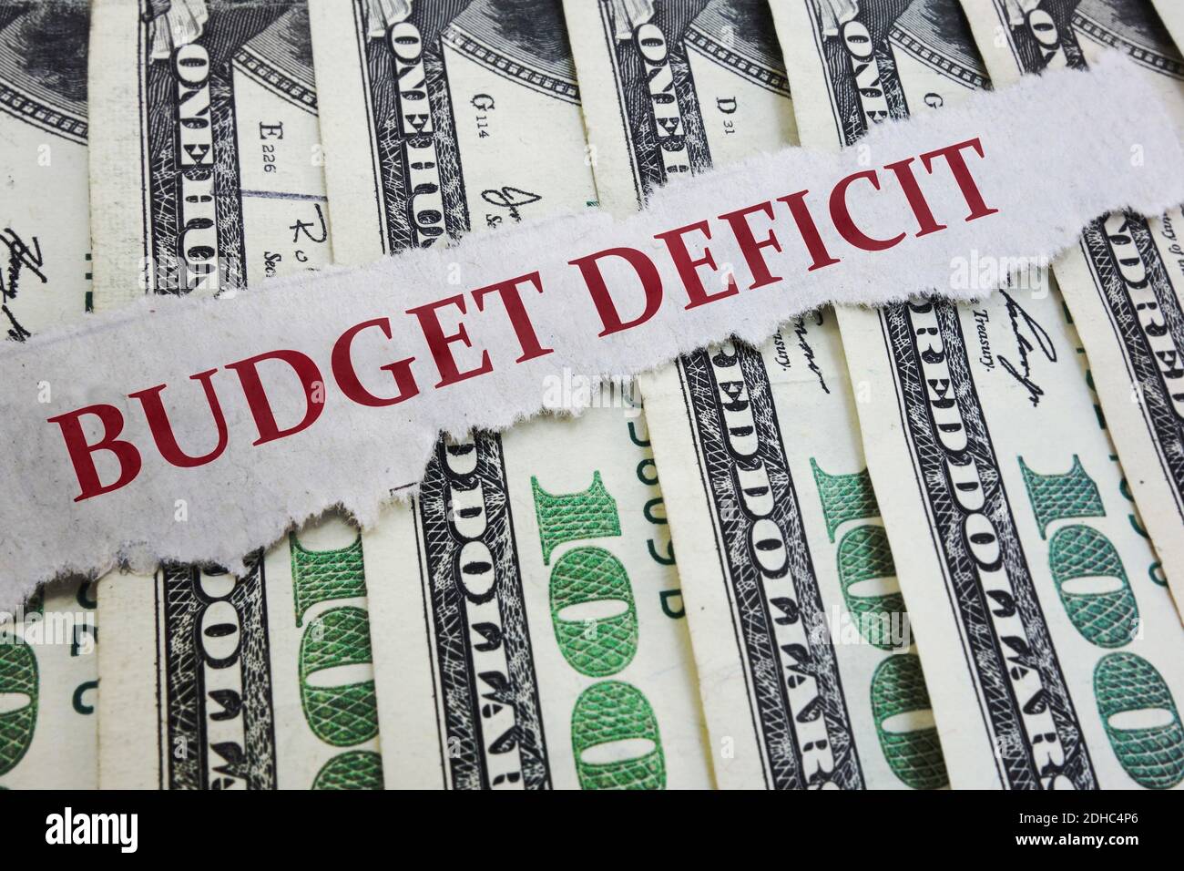 Budget Deficit newspaper headline on money Stock Photo - Alamy