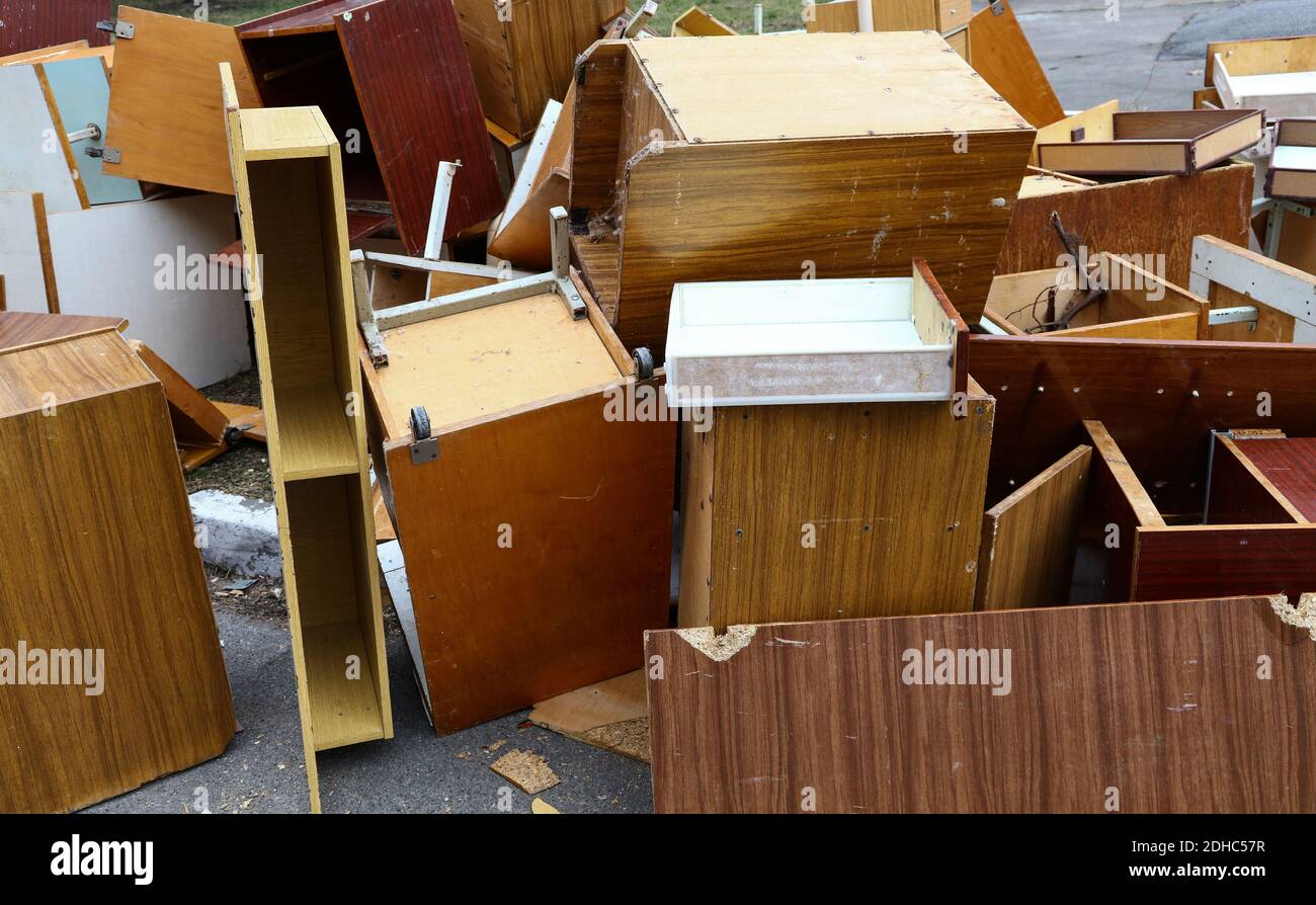 Old broken wooden furniture on waste dump site for recycling, high ...