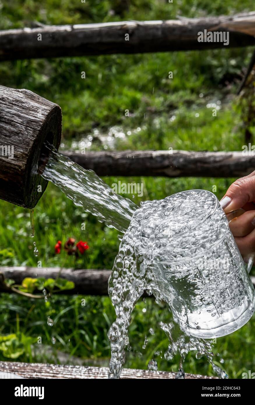 Big Glass Filled With Clear Mountain Drinking Water From A Wooden ...