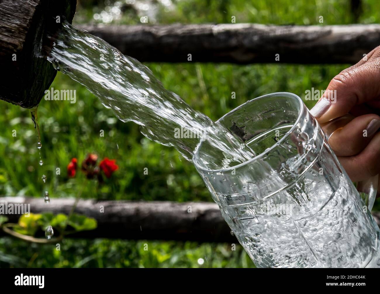 Big Glass Filled With Clear Mountain Drinking Water From A Wooden ...