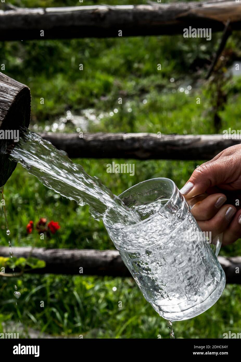 Big Glass Filled With Clear Mountain Drinking Water From A Wooden ...