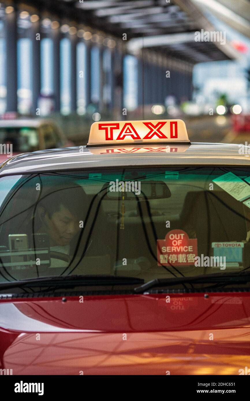 Illuminated sign on an iconic hong kong taxi hi-res stock photography ...