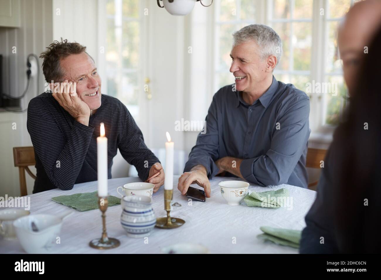 Sitting dining table hi-res stock photography and images - Alamy