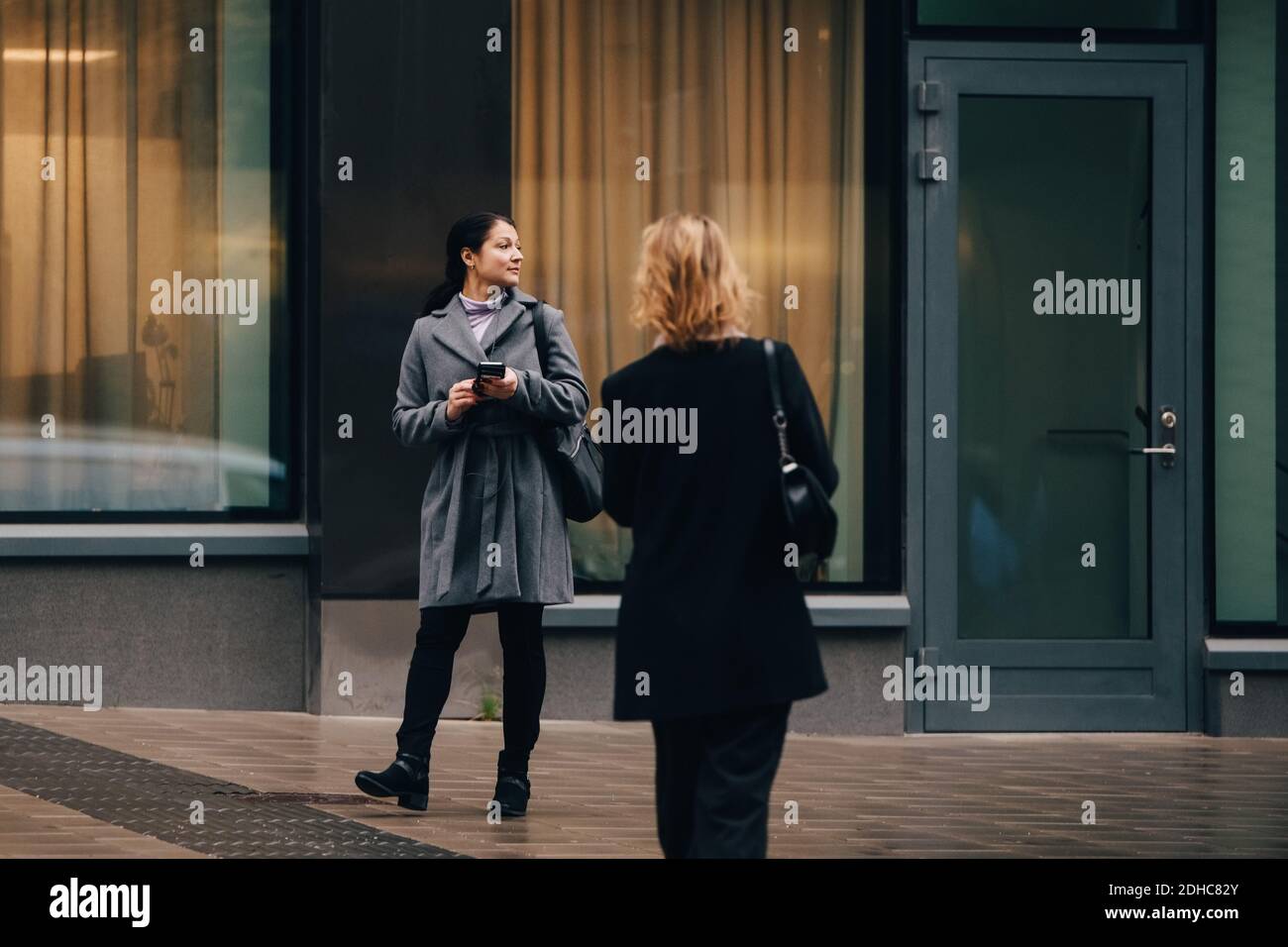 Walking building exterior looking away on the move hi-res stock ...