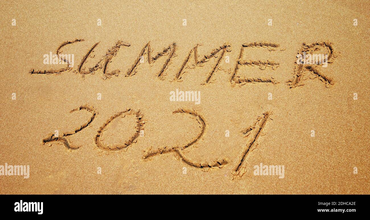 Summer 2021 etched in sand Stock Photo - Alamy