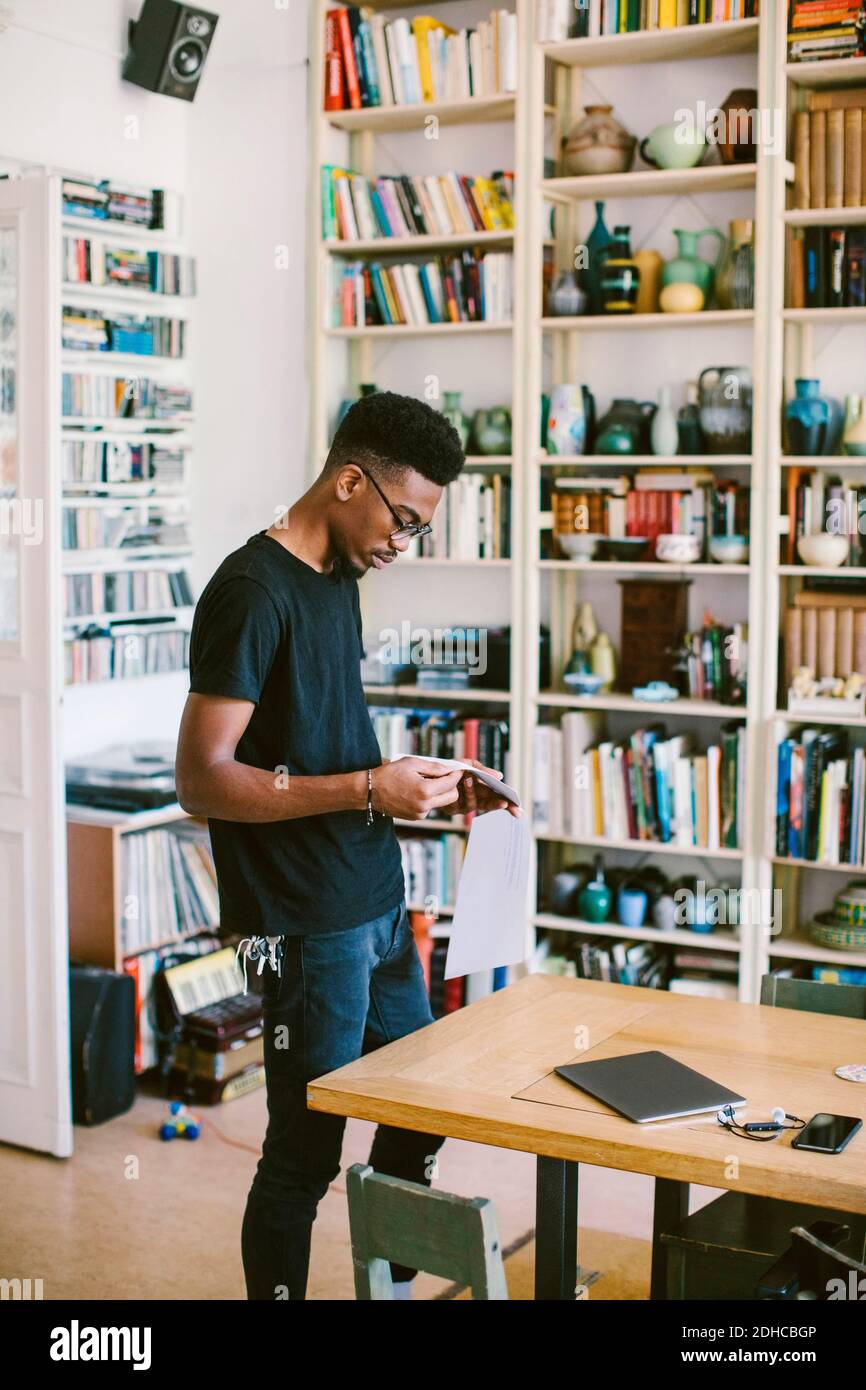 Interior with young man reading hi-res stock photography and images - Alamy