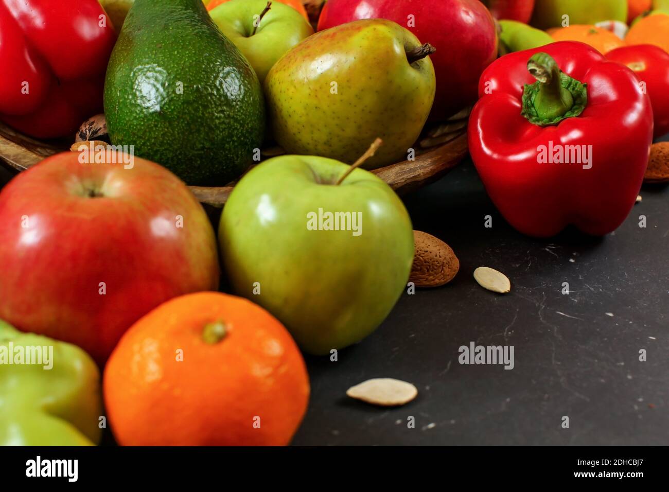 Mixed fruits and vegetables - red peppers, avocado, apples, pears ...