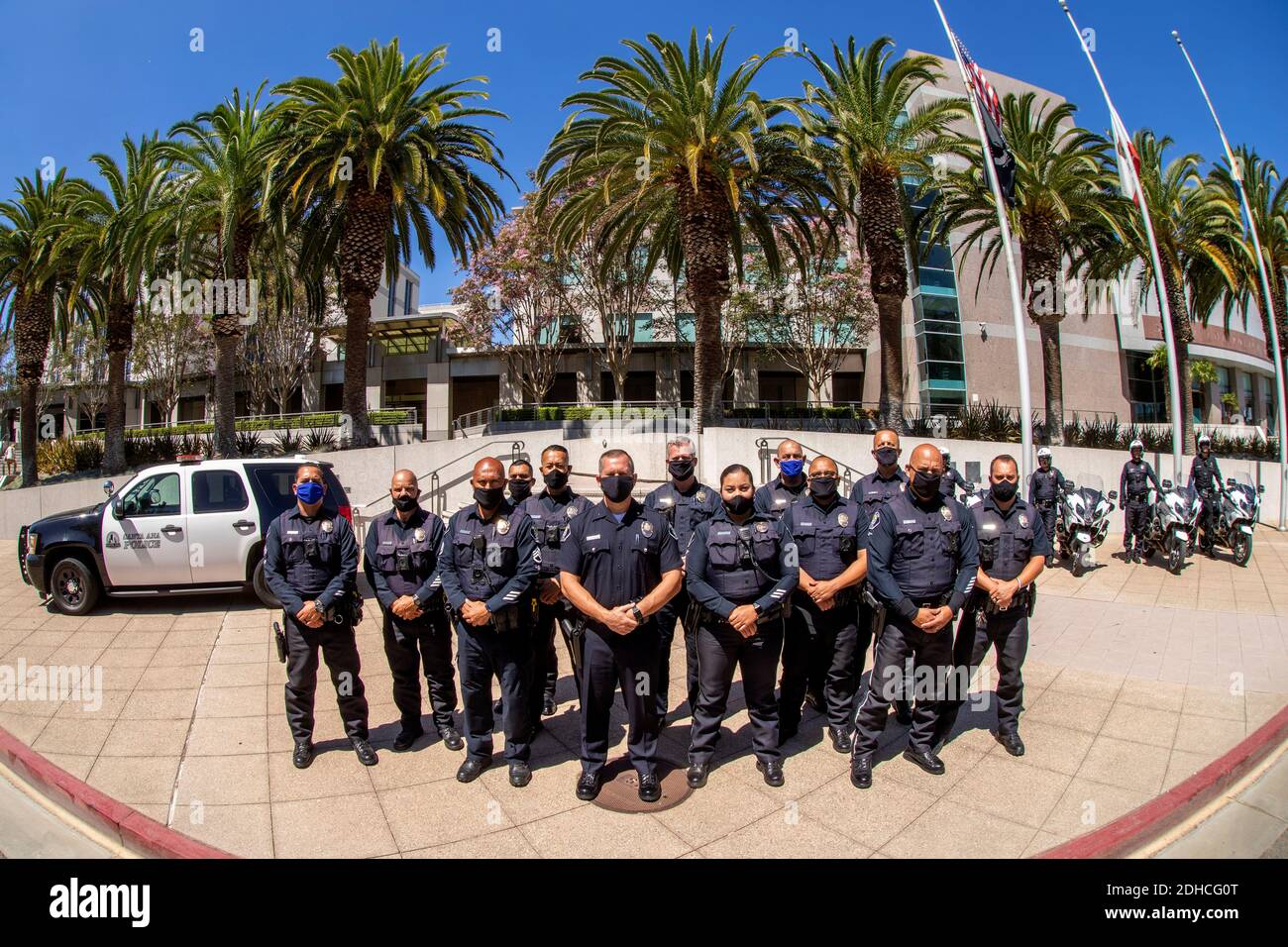 A masked multiethnic Santa Ana, CA, Police traffic squad poses ...