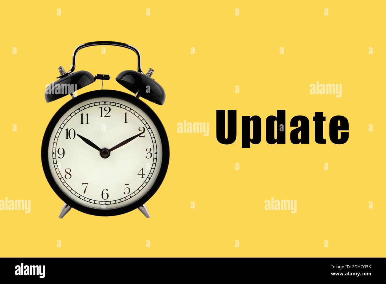 UPDATE text with alarm clock on yellow background. Business Concept ...