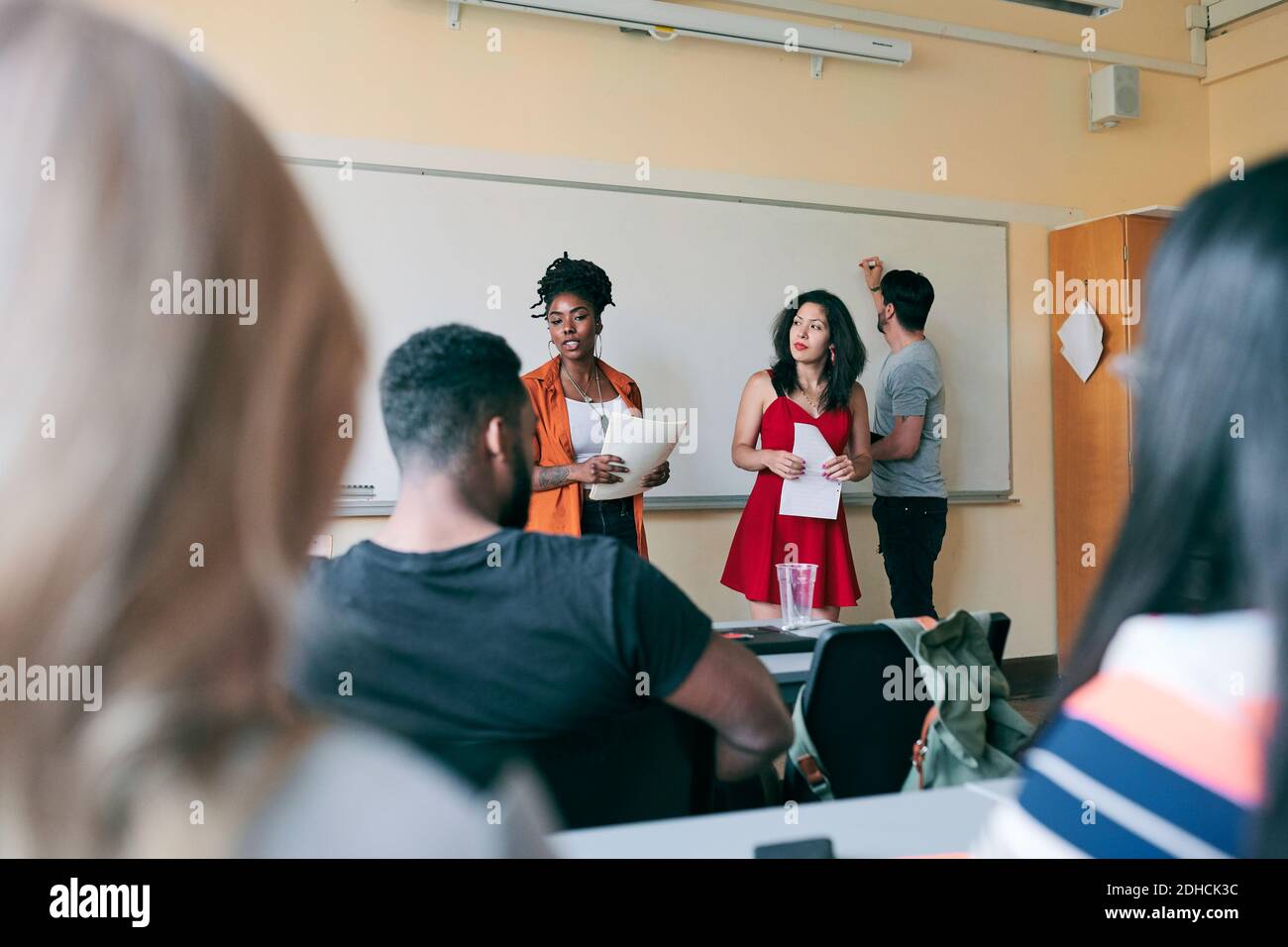 Multi-ethnic teachers teaching students in language school Stock Photo ...