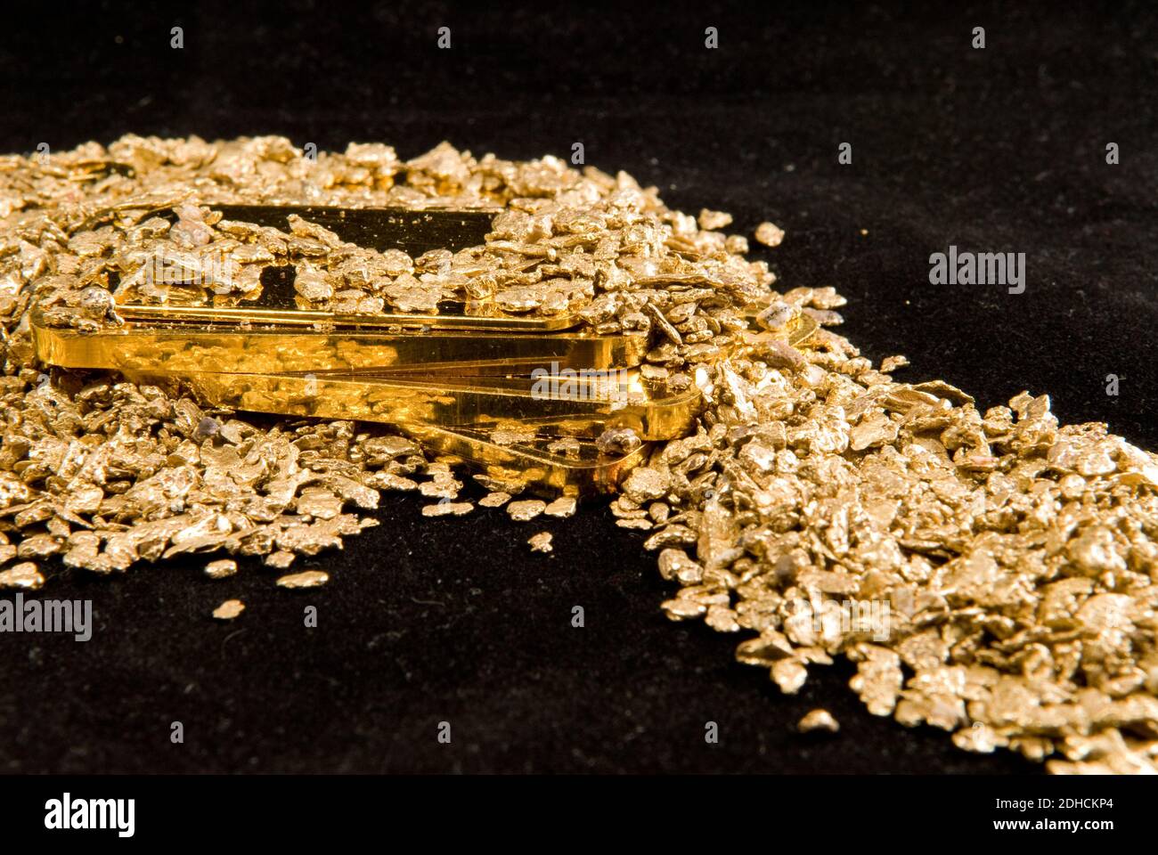 large samples of pure gold in various forms including coins, ingots ...