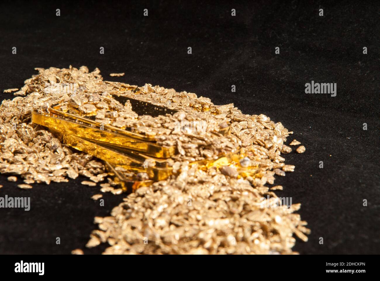 large samples of pure gold in various forms including coins, ingots ...