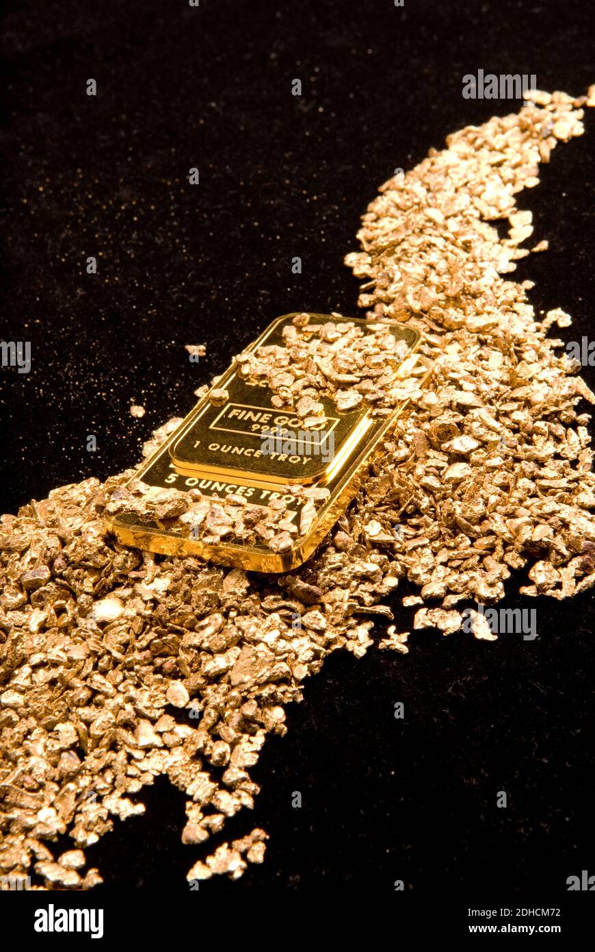 large samples of pure gold in various forms including coins, ingots ...